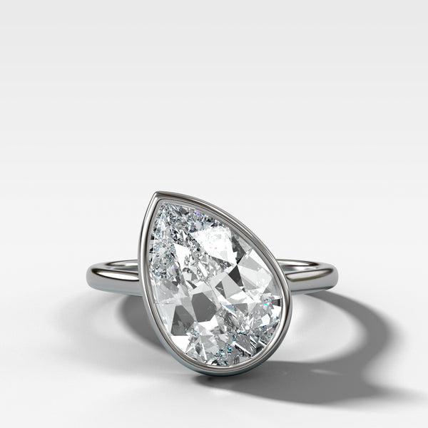 Penumbra Bezel Set Engagement Ring With Tilted Pear Cut - GOODSTONE
