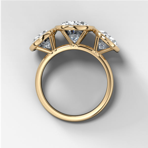 Penumbra Bezel Triad Engagement Ring With Oval Cut Diamonds | GOODSTONE