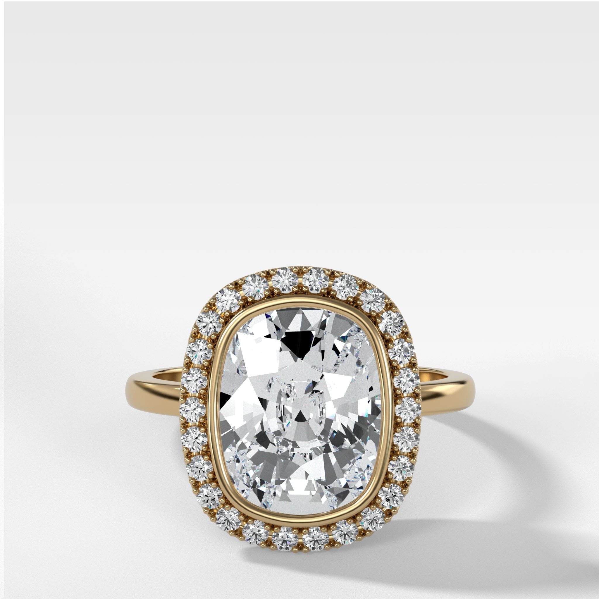 Bezel Set Halo Engagement Ring With Elongated Cushion Cut Diamond ...
